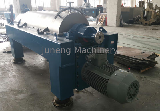 Two-phase scroll discharge decanter centrifuge for centrifugal dewatering